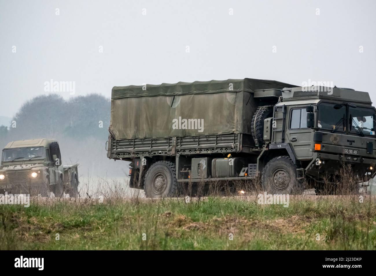 a small convoy British Army Land Rover Defender Wolf medium utility ...