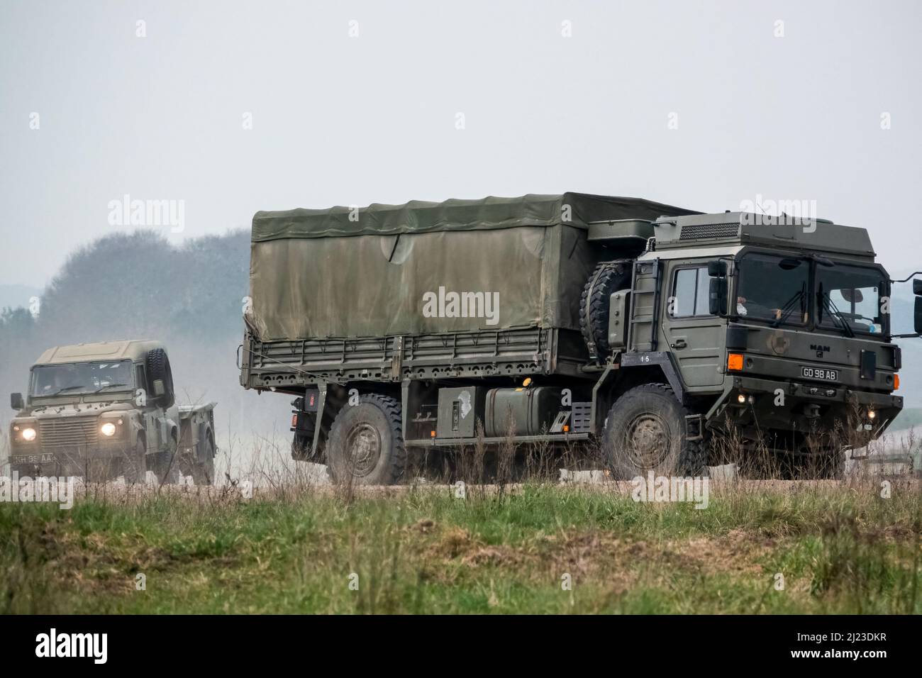 a small convoy British Army Land Rover Defender Wolf medium utility ...