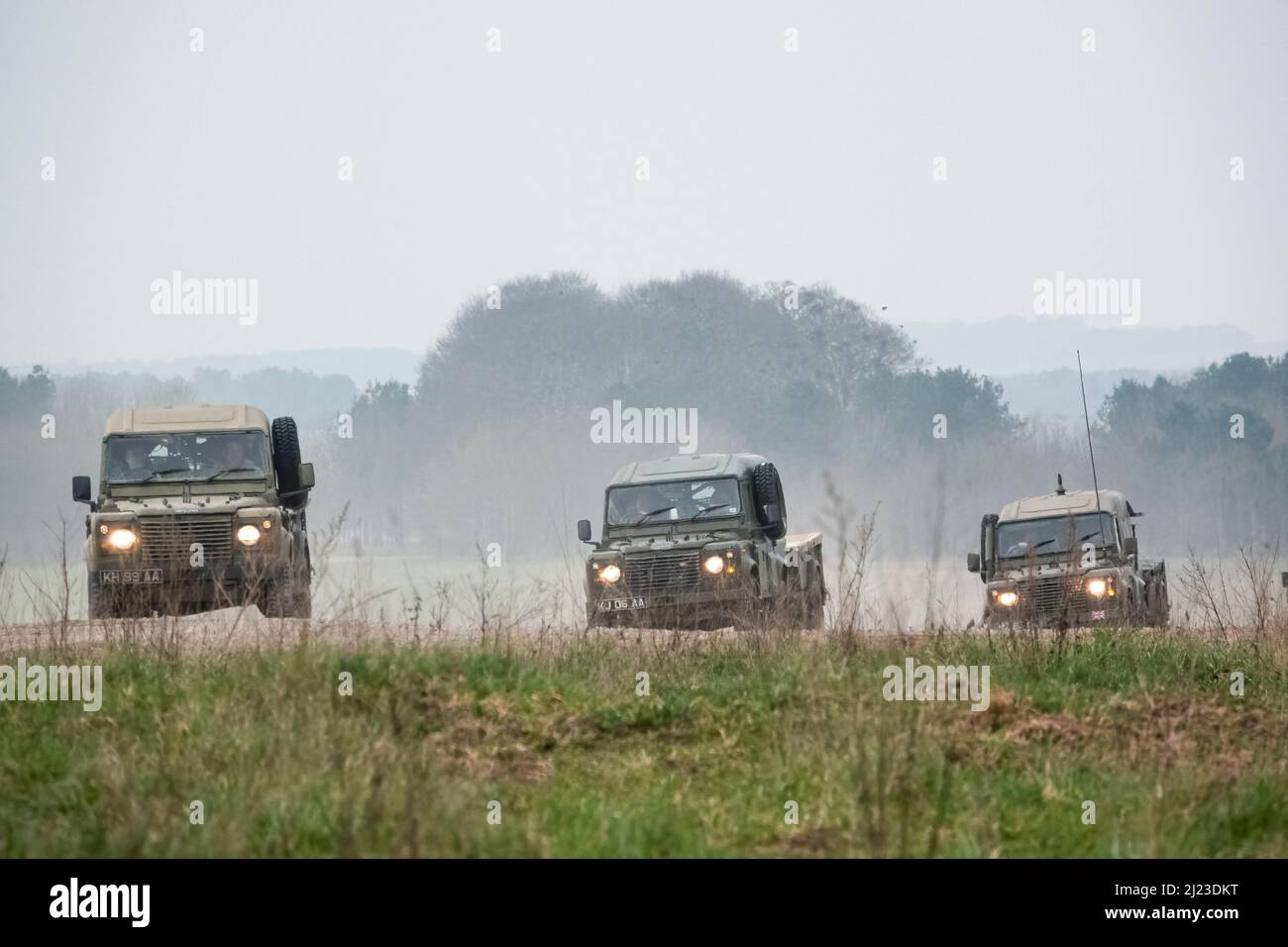 a small convoy British Army Land Rover Defender Wolf medium utility ...