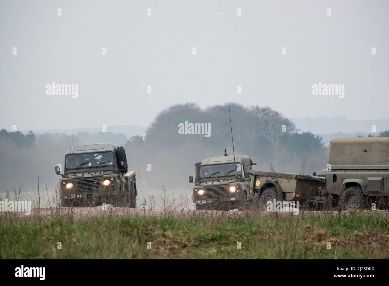 a small convoy British Army Land Rover Defender Wolf medium utility ...