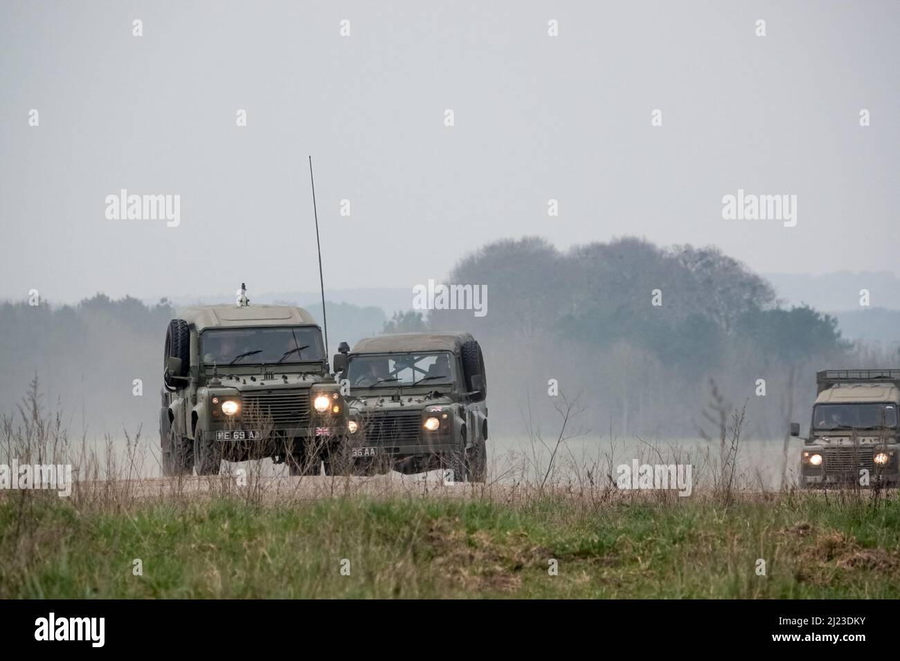 a small convoy British Army Land Rover Defender Wolf medium utility ...