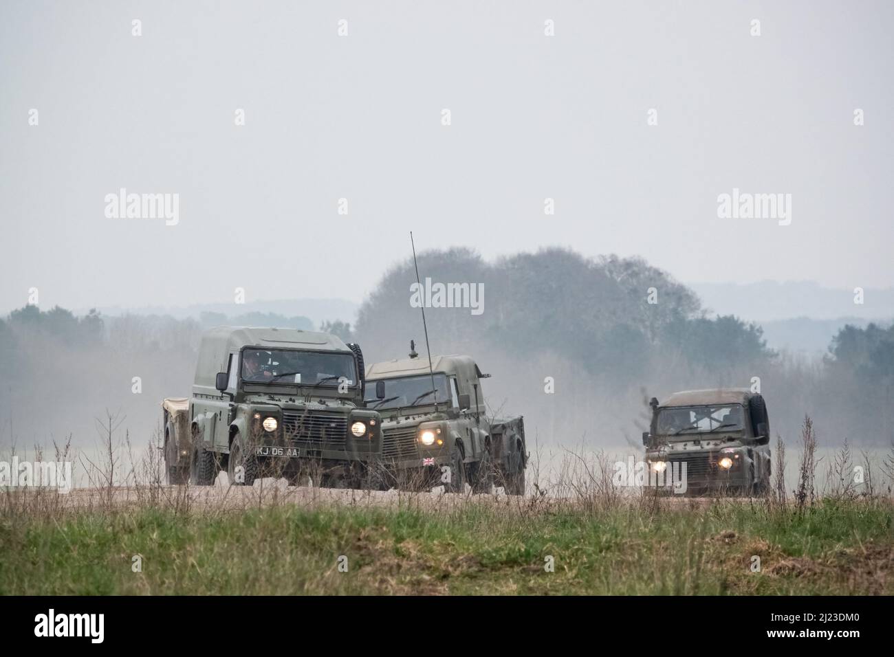 a small convoy British Army Land Rover Defender Wolf medium utility ...