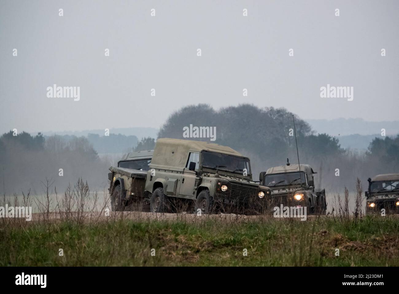 a small convoy British Army Land Rover Defender Wolf medium utility ...