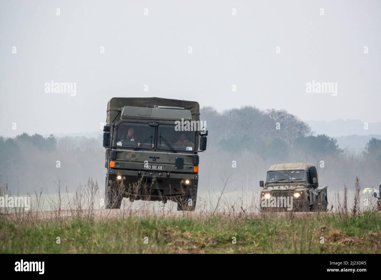 a small convoy British Army Land Rover Defender Wolf medium utility ...