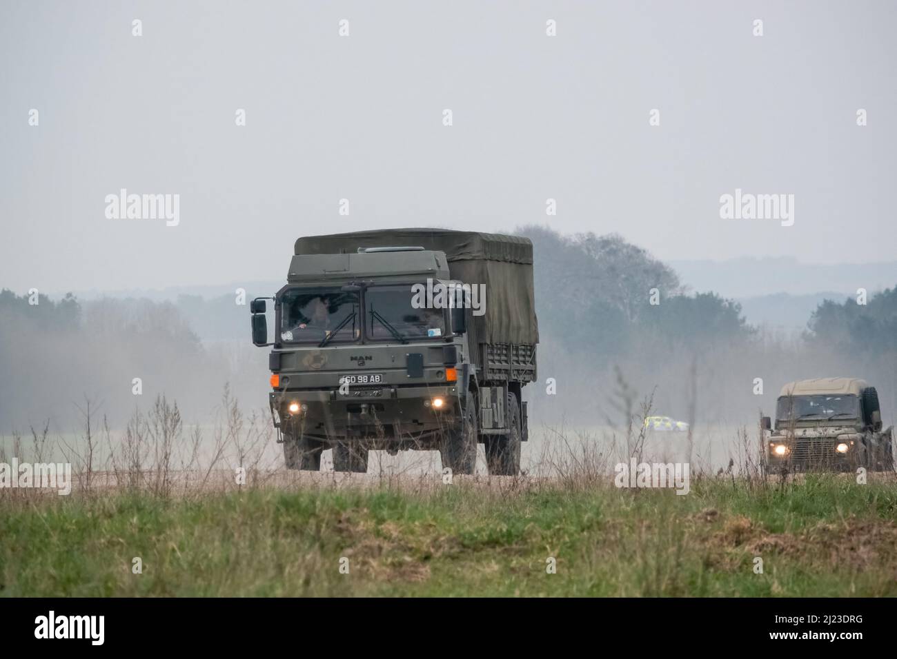 a small convoy British Army Land Rover Defender Wolf medium utility ...