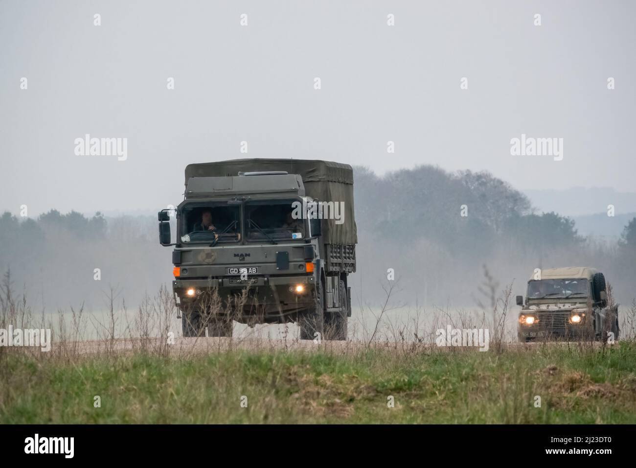 a small convoy British Army Land Rover Defender Wolf medium utility ...