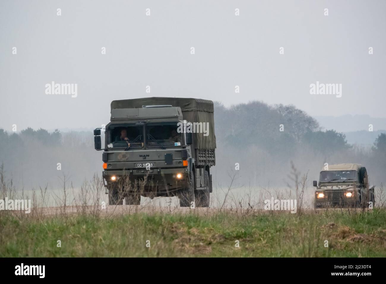 a small convoy British Army Land Rover Defender Wolf medium utility ...