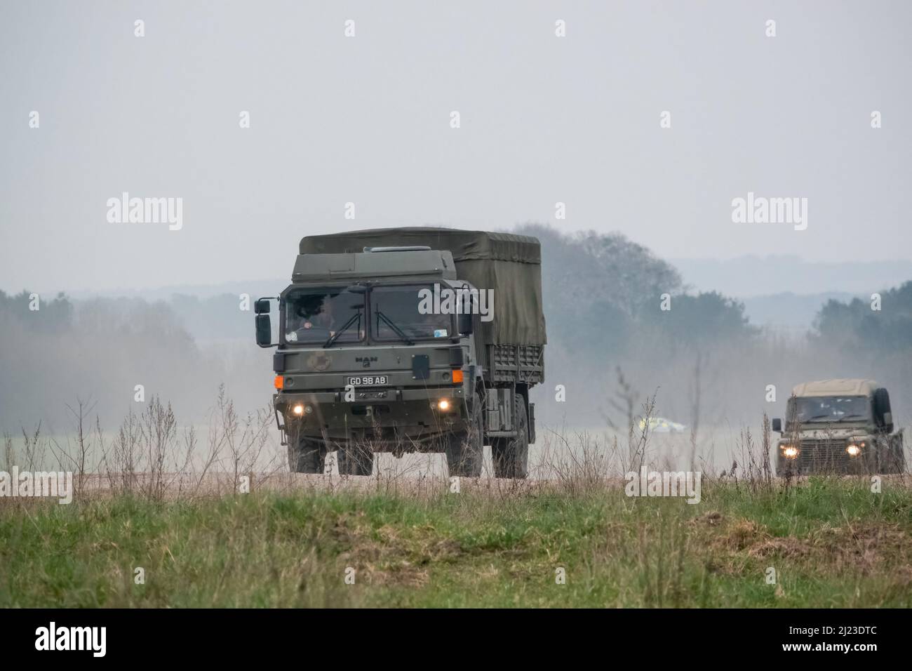 a small convoy British Army Land Rover Defender Wolf medium utility ...