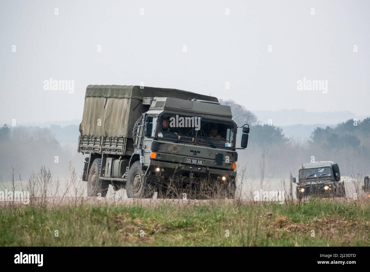 a small convoy British Army Land Rover Defender Wolf medium utility ...