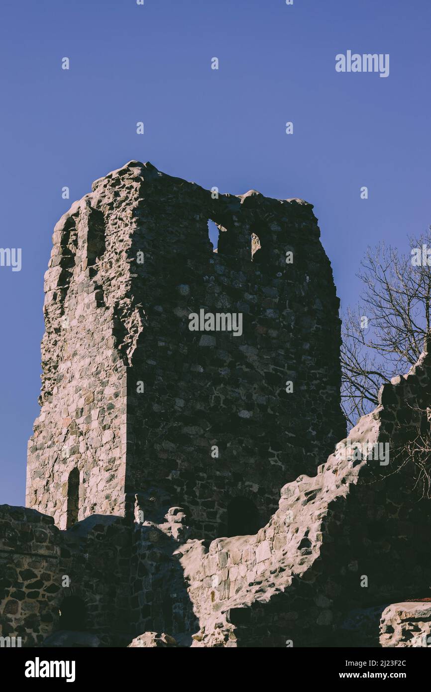 An old ruined tower facade in the blue sky background Stock Photo - Alamy