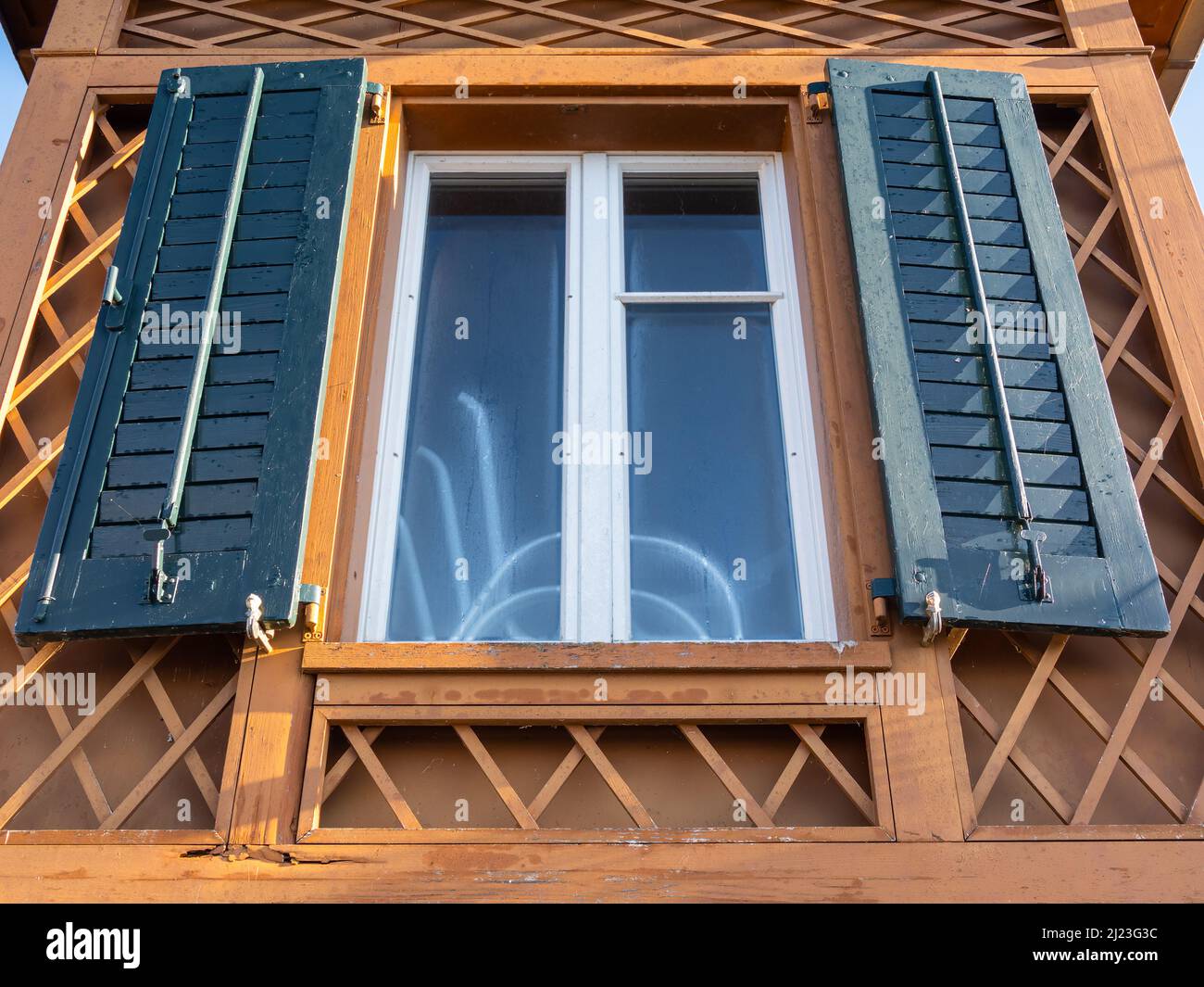 Zug, Switzerland - December 31, 2021: A window with blue shutters on ...