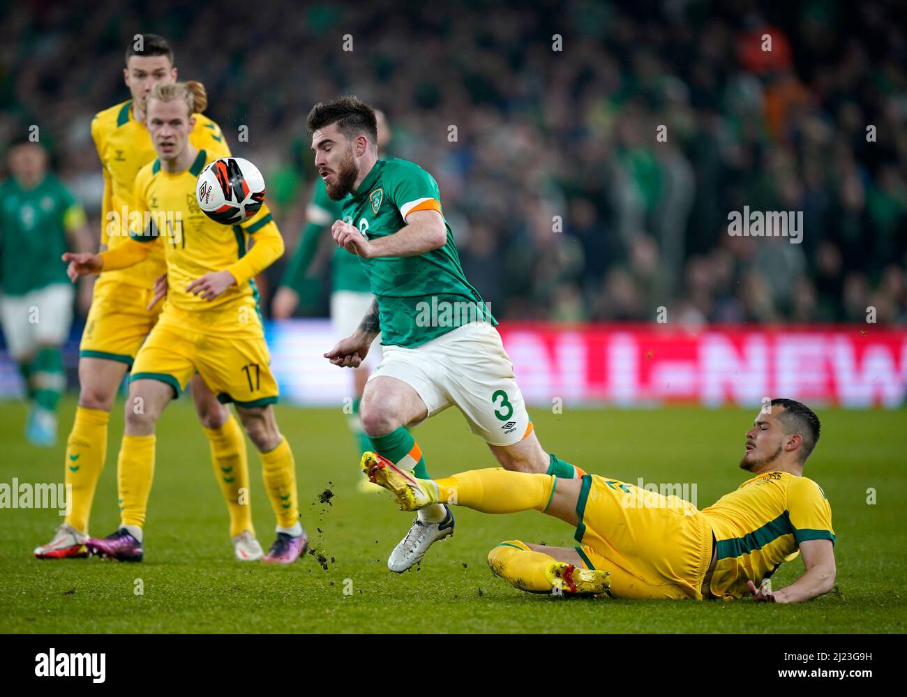 Republic of Ireland's Ryan Manning is tackled by Lithuania's Rolandas ...