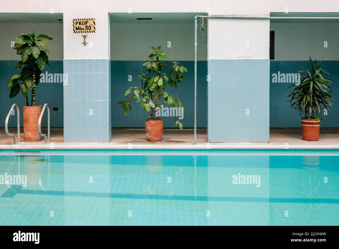 Indoor pool in empty hotel Stock Photo - Alamy