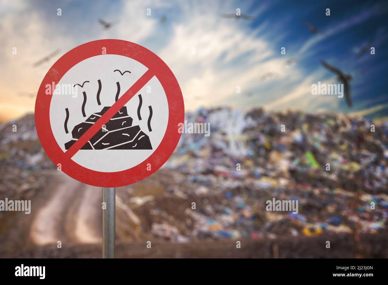 Forbidden dump sign. Landfill with waste in background Stock Photo - Alamy
