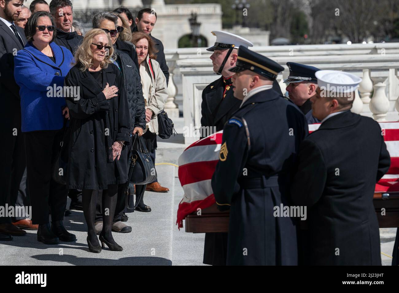 Anne Young, the wife of Congressman Edwin Young, covers her heart as an ...