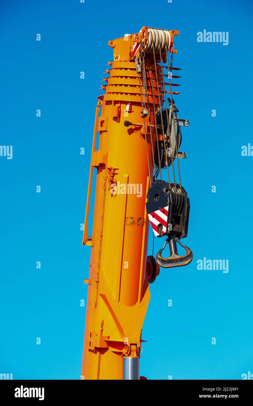 Heavy-duty truck crane boom. Raised arrow of a truck crane against the ...