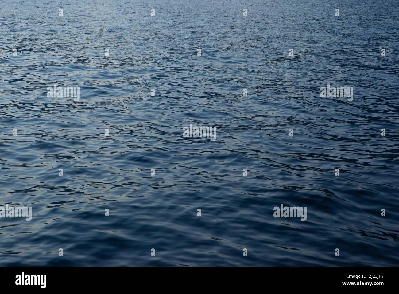 Close-up blue sea background. A backing with sea waves texture for ...
