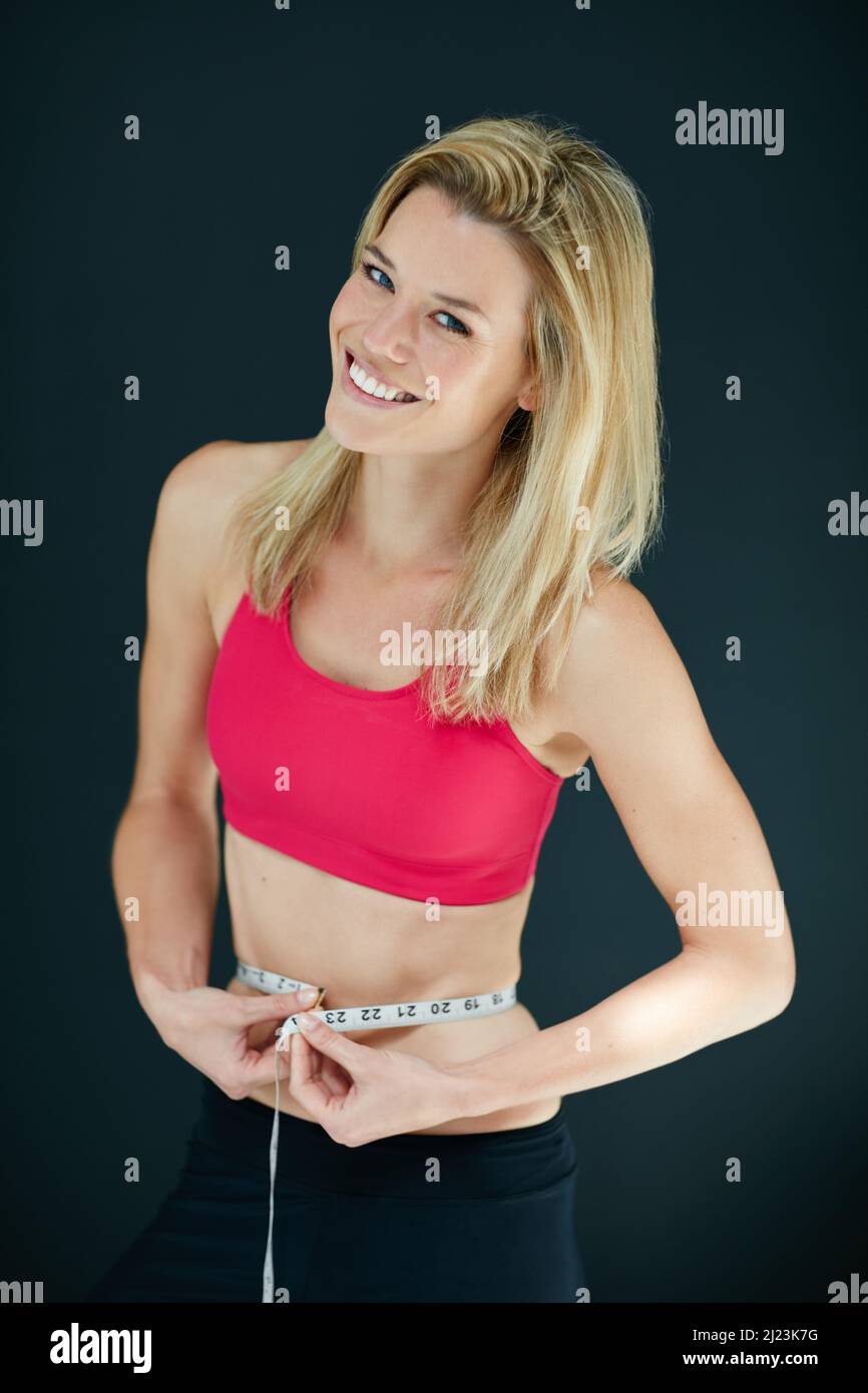My diets definitely working. Cropped portrait of an attractive young ...