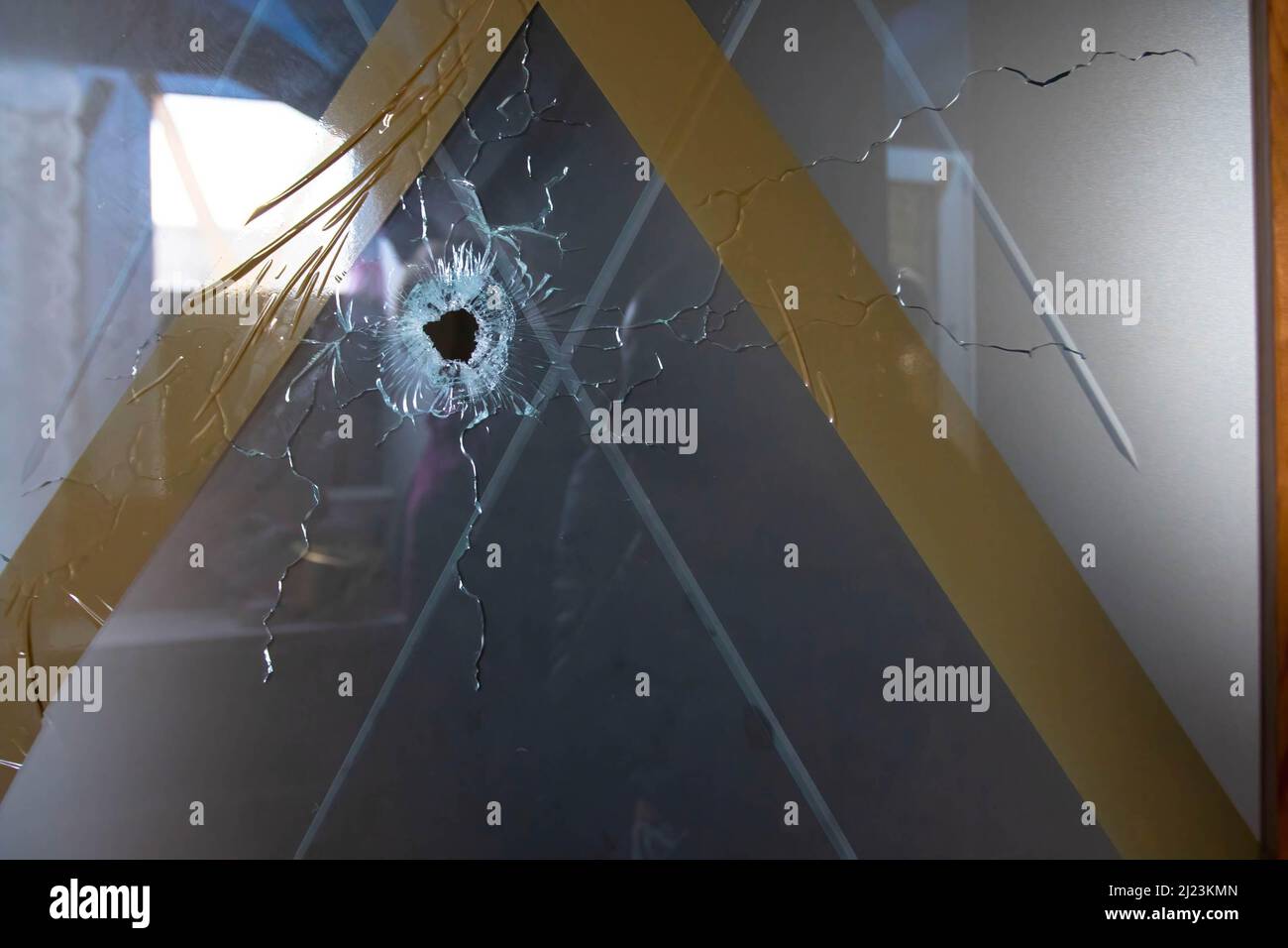Boyarka, Ukraine. 29th Mar, 2022. A frosted glass window with a hole ...
