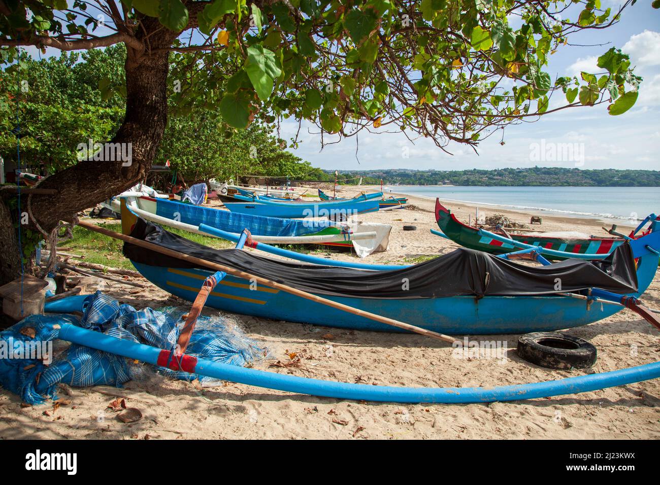 Traditional wooden perahu fishing boats on Jimbaran Beach in Bali ...
