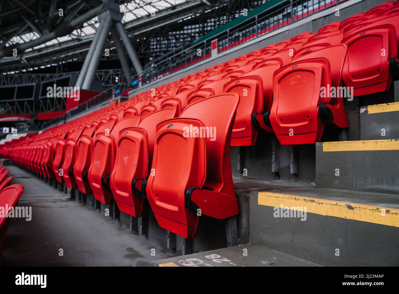 Rows of seats in a football stadium. Bright red stadium seats Stock ...