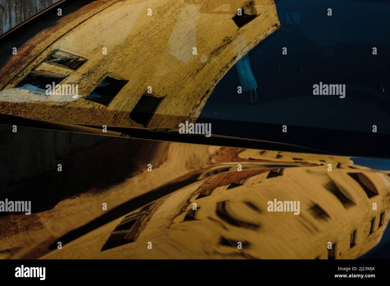 Reflection of a house in the windscreen and on the car bonnet Stock ...