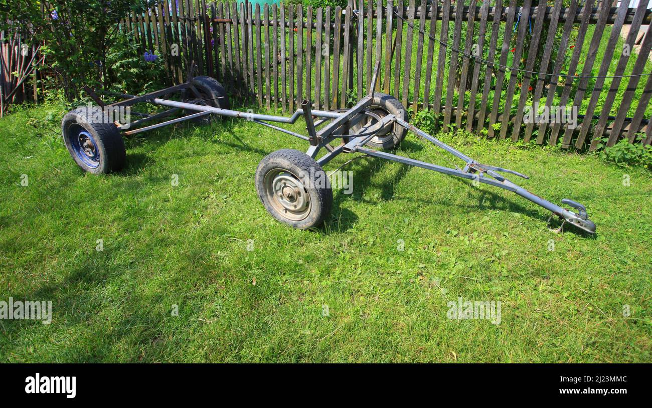 old metal carriage for tractor transportation Stock Photo - Alamy