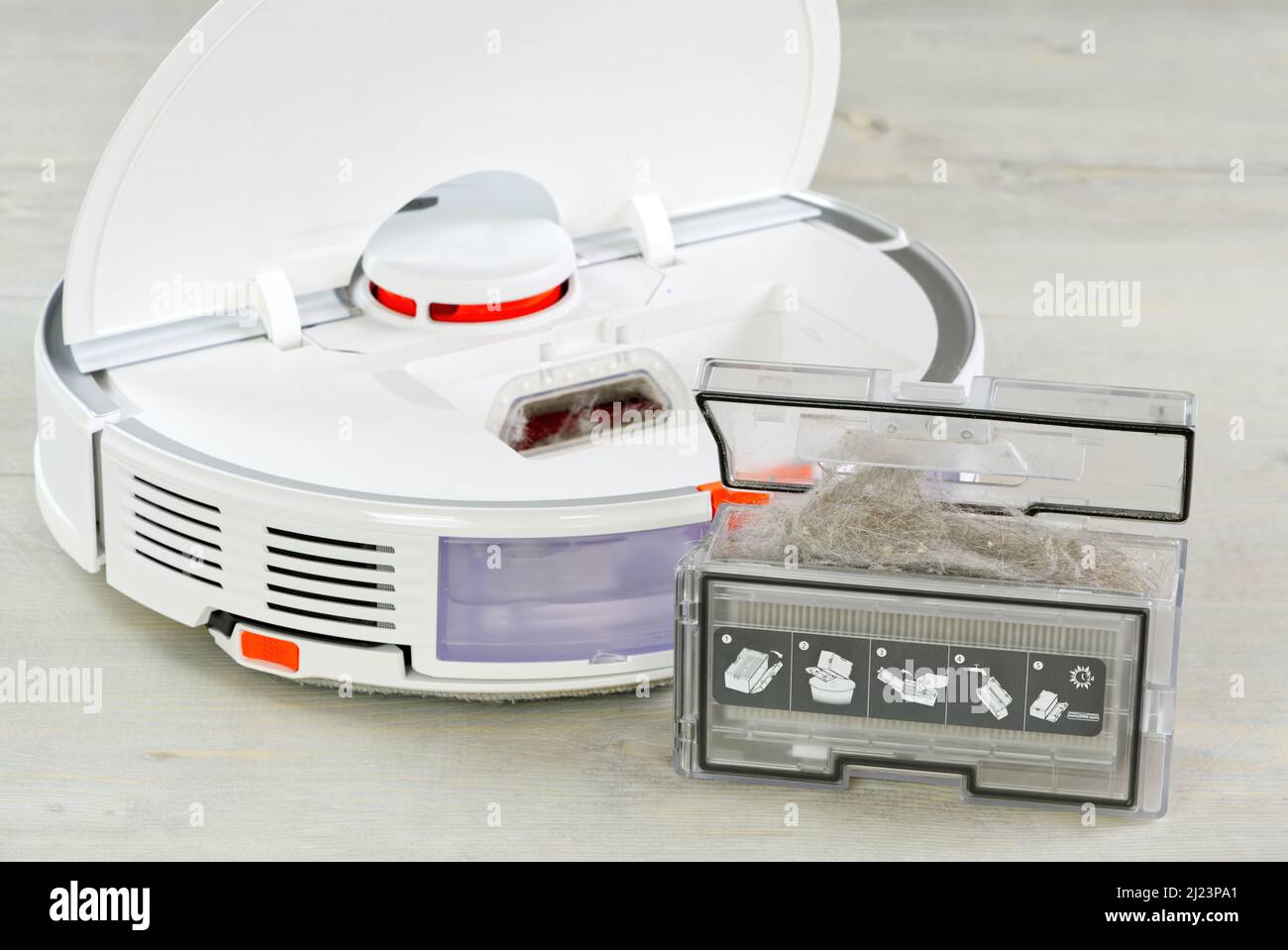 robot vacuum cleaner water tank removed and the filter lid is opened to ...