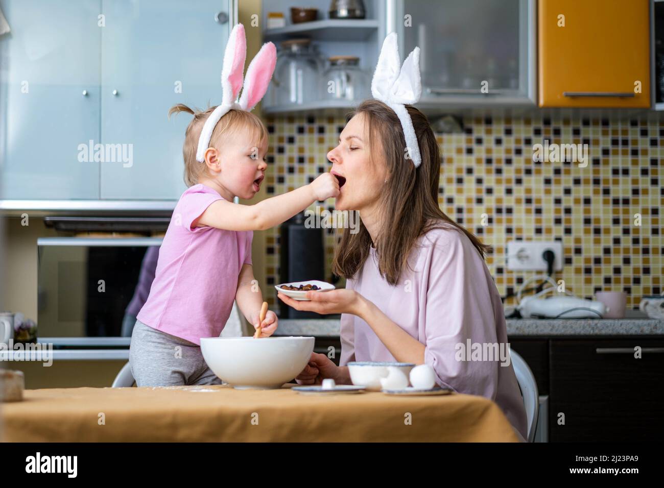 Happy easter, Joyful family mom and daughter wearing bunny ears ...