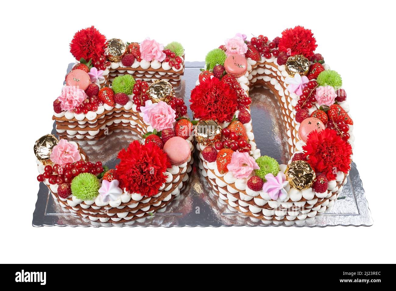 Festive original cake in the form of numbers fifty covered with sweets ...