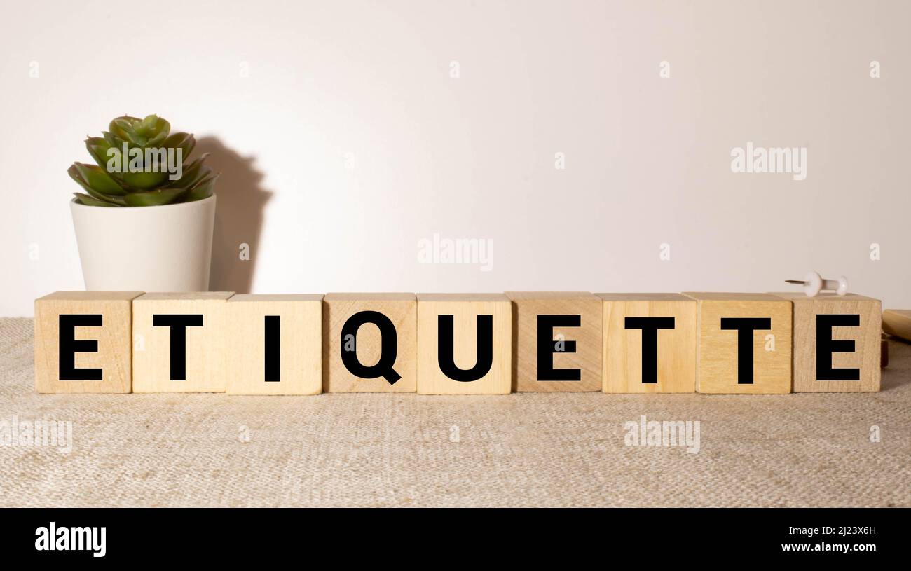 ETIQUETTE word written on wood block. ETIQUETTE text on wooden table ...