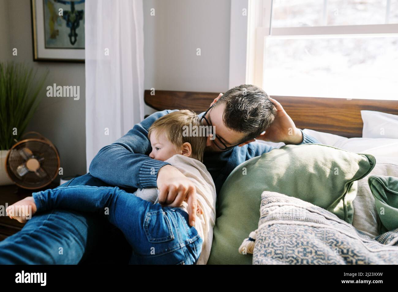 Father son cuddling home hi-res stock photography and images - Alamy