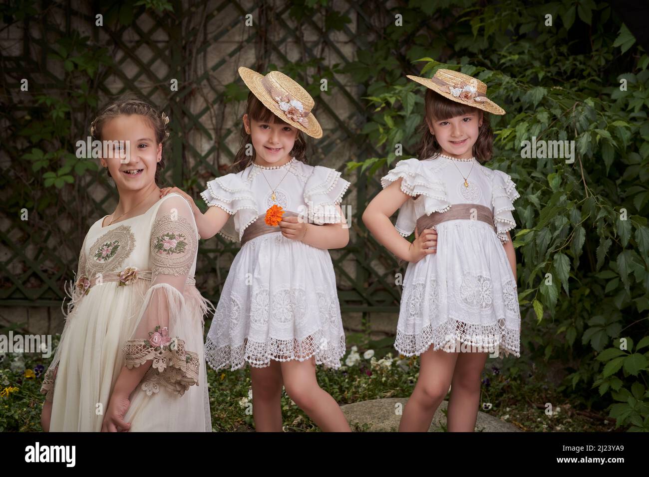 Smiling young girl in white dress for first communion hi-res stock ...