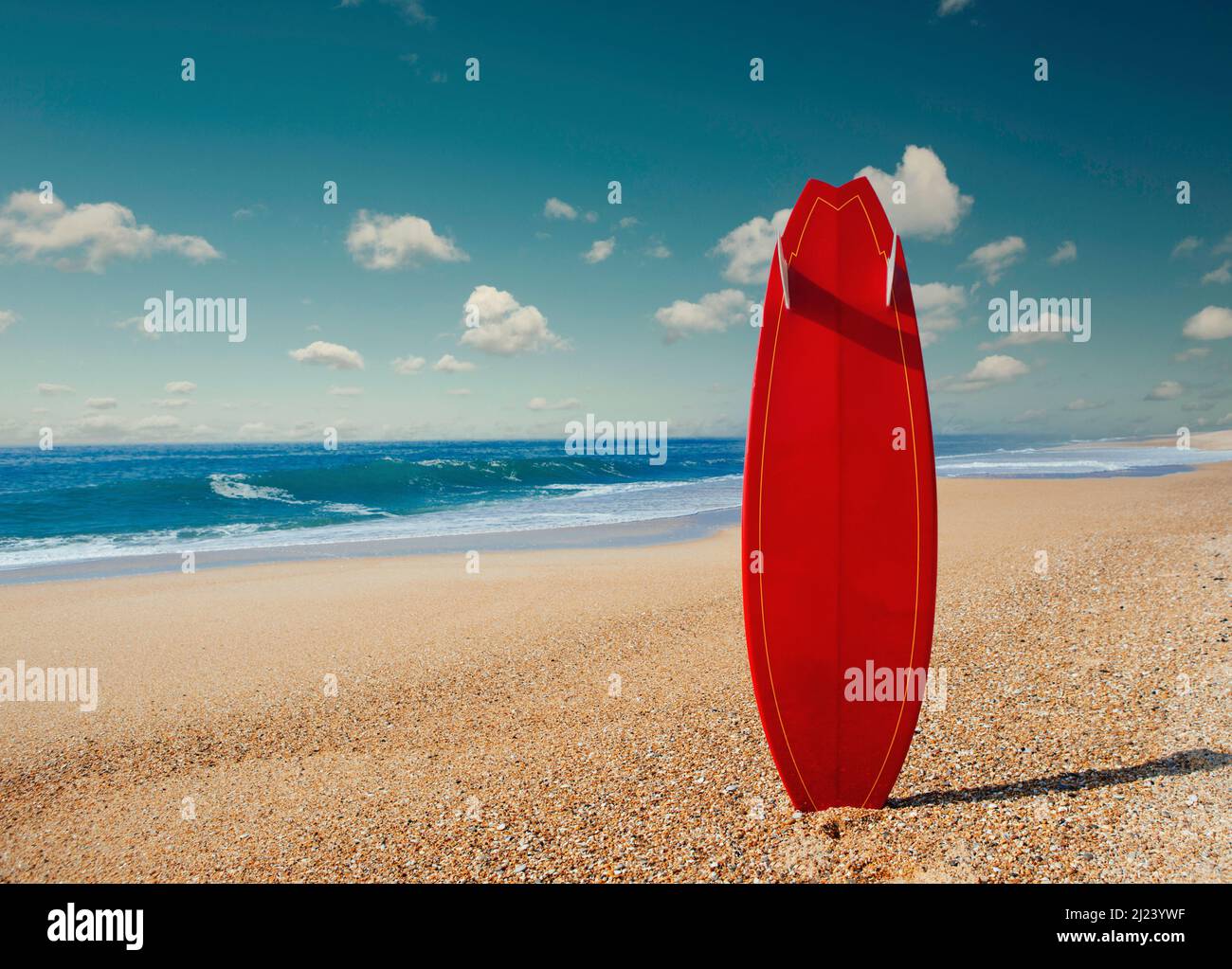 Beautiful beach with a red surfboard in the sand Stock Photo - Alamy