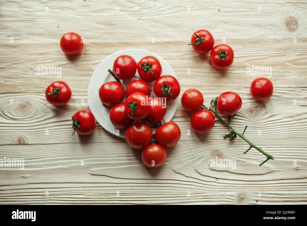 Cherry tomatoes on colored hi-res stock photography and images - Alamy