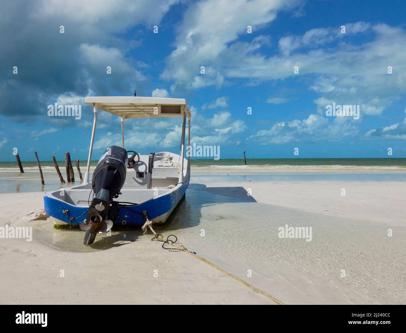 boat in the sand on a paradisiacal and lonely beach Stock Photo - Alamy
