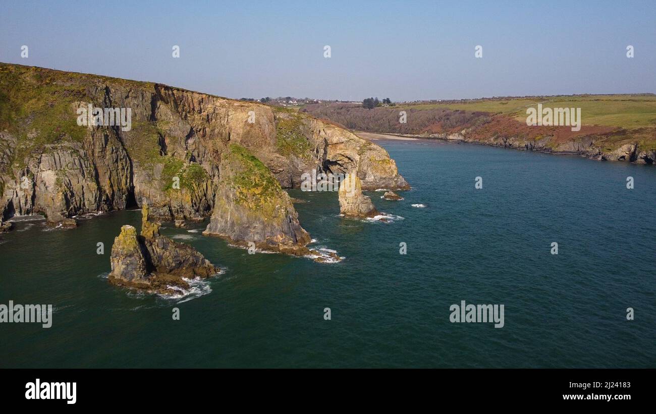drone over the Atlantic Ocean. flying over cliffs and a blue sea ...