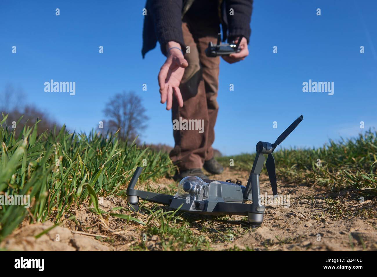 shocked man with broken drone. Worried man with crashed gadget. Excited ...