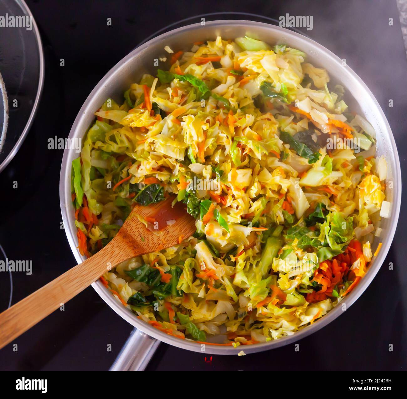 Homemade braised white cabbage with vegetables Stock Photo - Alamy