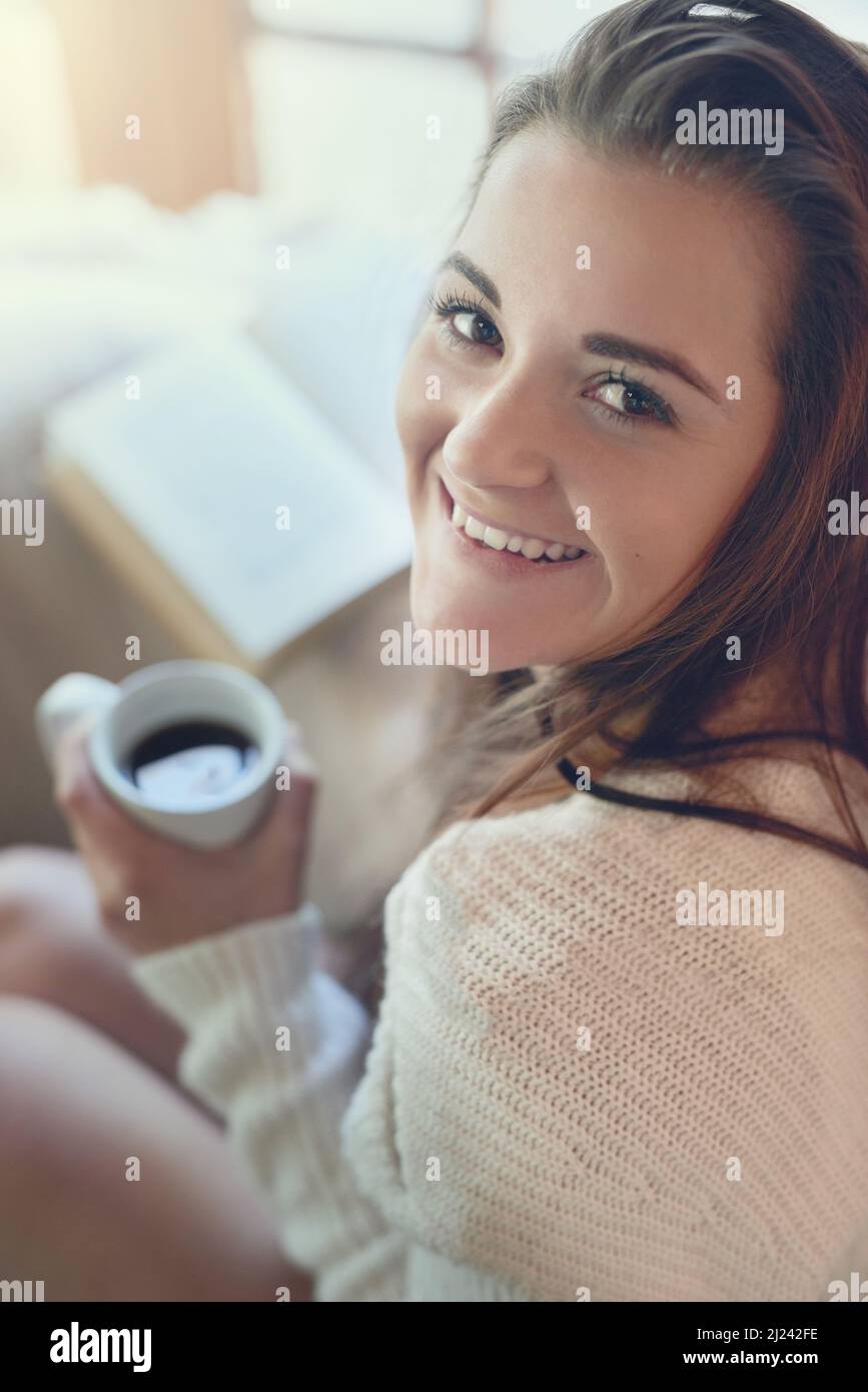 Weekends are all about taking it easy. Portrait of a beautiful young ...