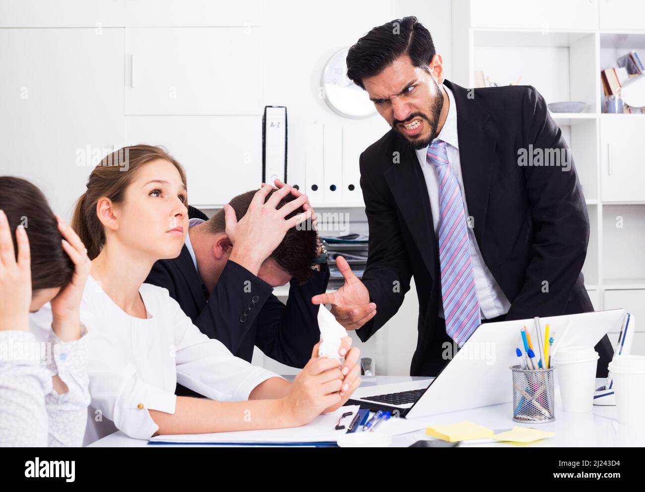 Outraged manager with colleagues at meeting Stock Photo - Alamy