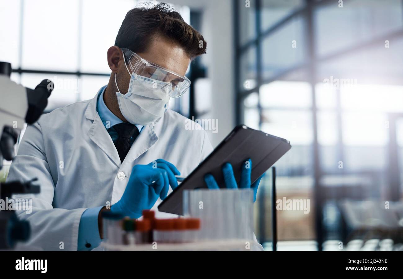 Doing tests to see what works. Cropped shot of a young male scientist ...