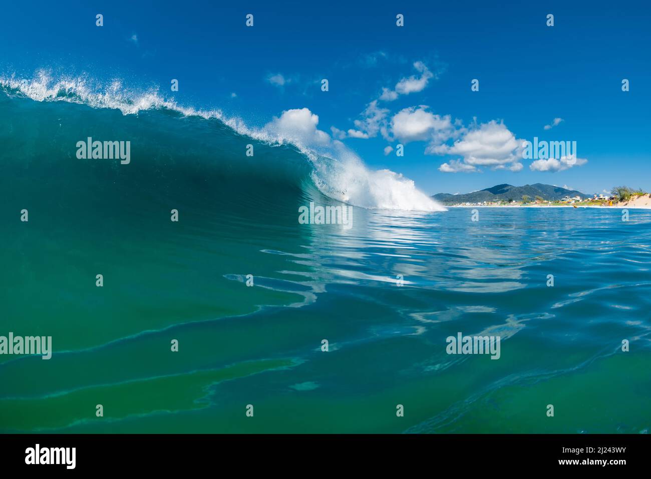 Turquoise beach break waves in ocean. Breaking glassy wave with blue ...