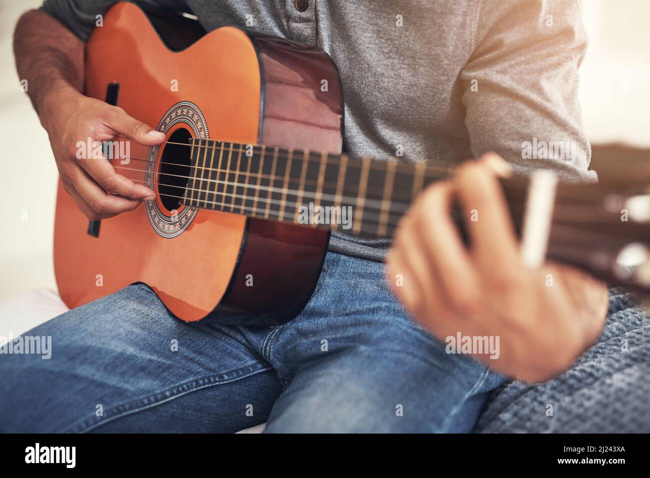 He lets the music flow from his hands. Shot of an unrecognizable man ...