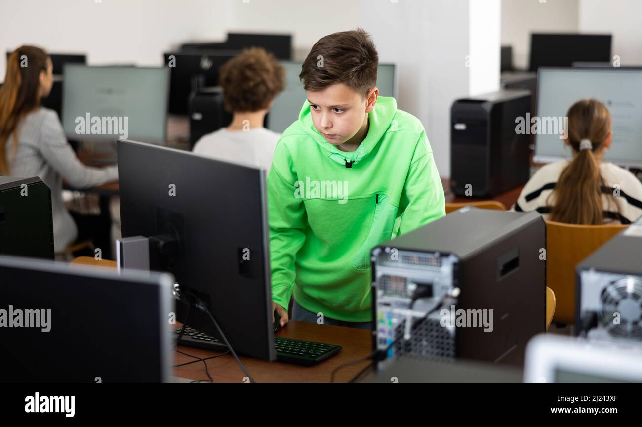 Reading computer interested hi-res stock photography and images - Alamy