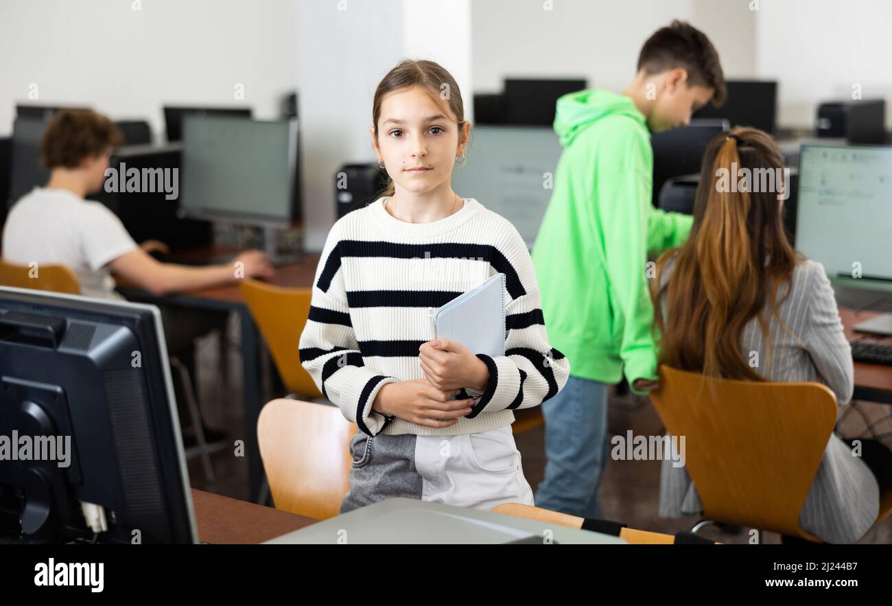Young girl learning to use personal computer during lesson Stock Photo ...