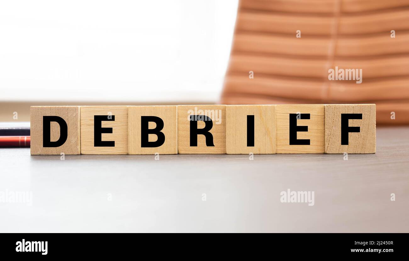 debrief word in a dictionary. debrief concept Stock Photo - Alamy