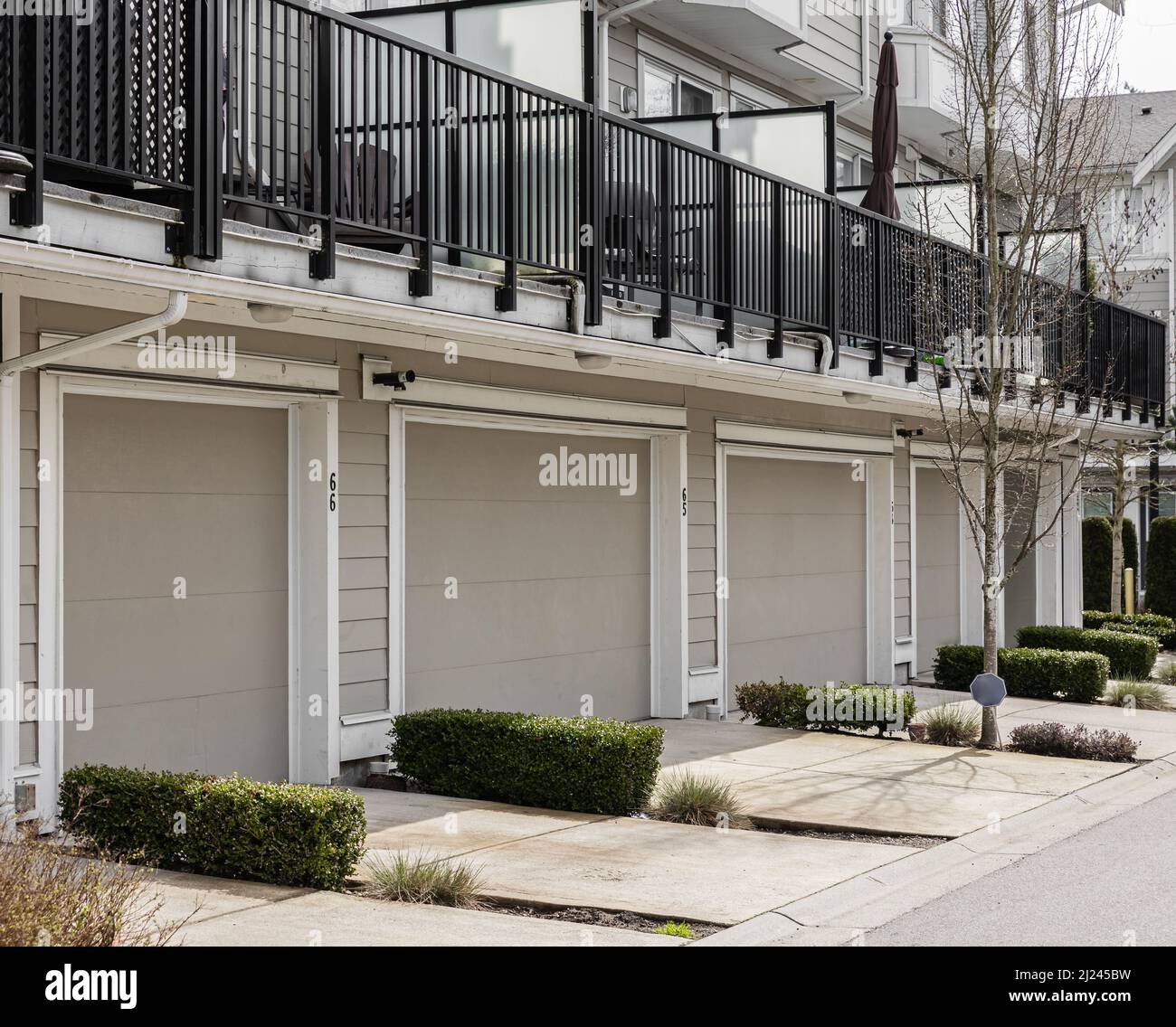 Neighborhood modern houses with garages in BC, Canada. Canadian modern ...