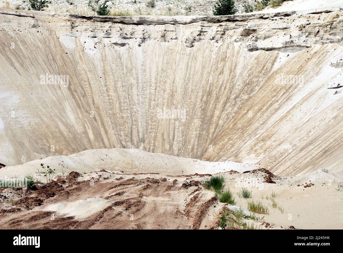 Slope of sandy mountain from white sand Stock Photo - Alamy
