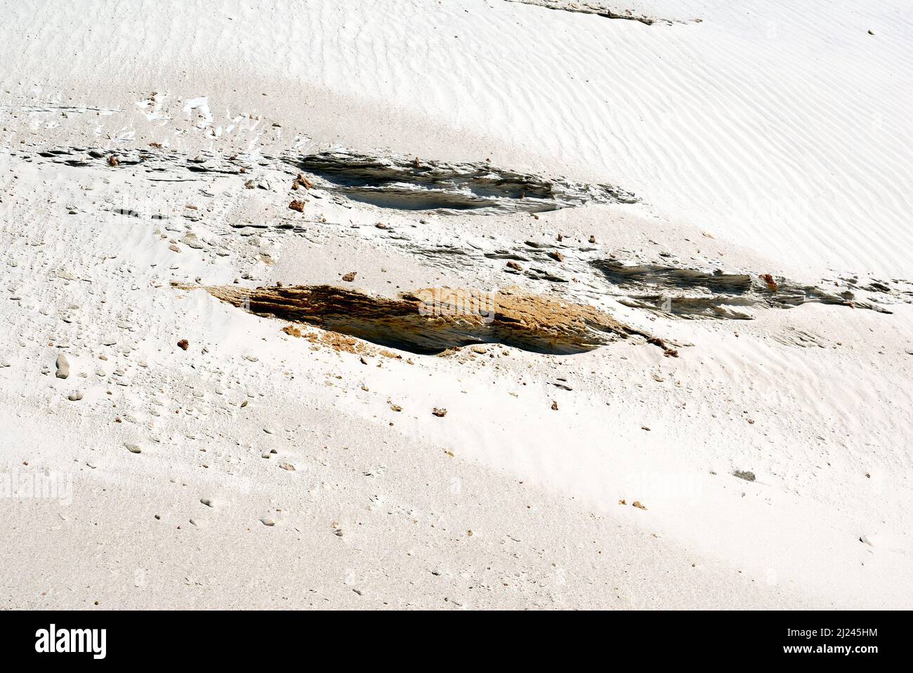 Sculptures from sand against a slope of sandy mountain Stock Photo - Alamy